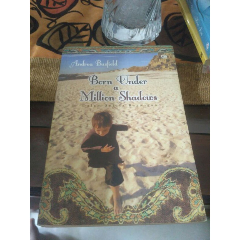 Jual buku novel Born Under a Million Shadows karya Andrea Busfield ...