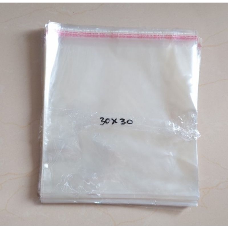 Jual Plastik OPP Lem/Plastik Kaca ukuran 30cm x 30cm,Tebal 20 Micron (isi:100 lembar) | Shopee ...
