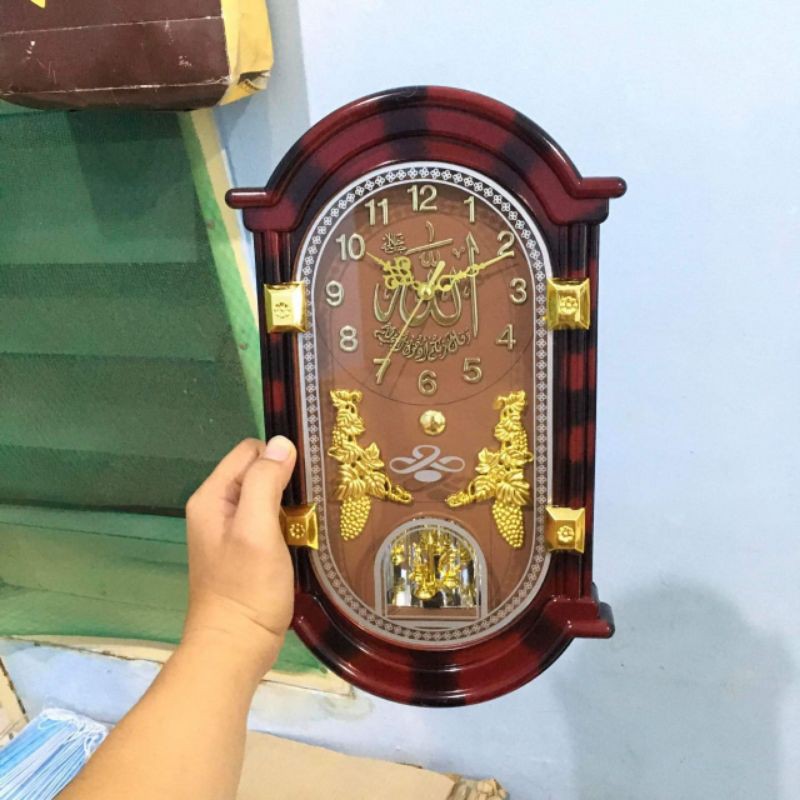 Jual jam dinding bandul putar kaligrafi bunyi perjam | Shopee Indonesia