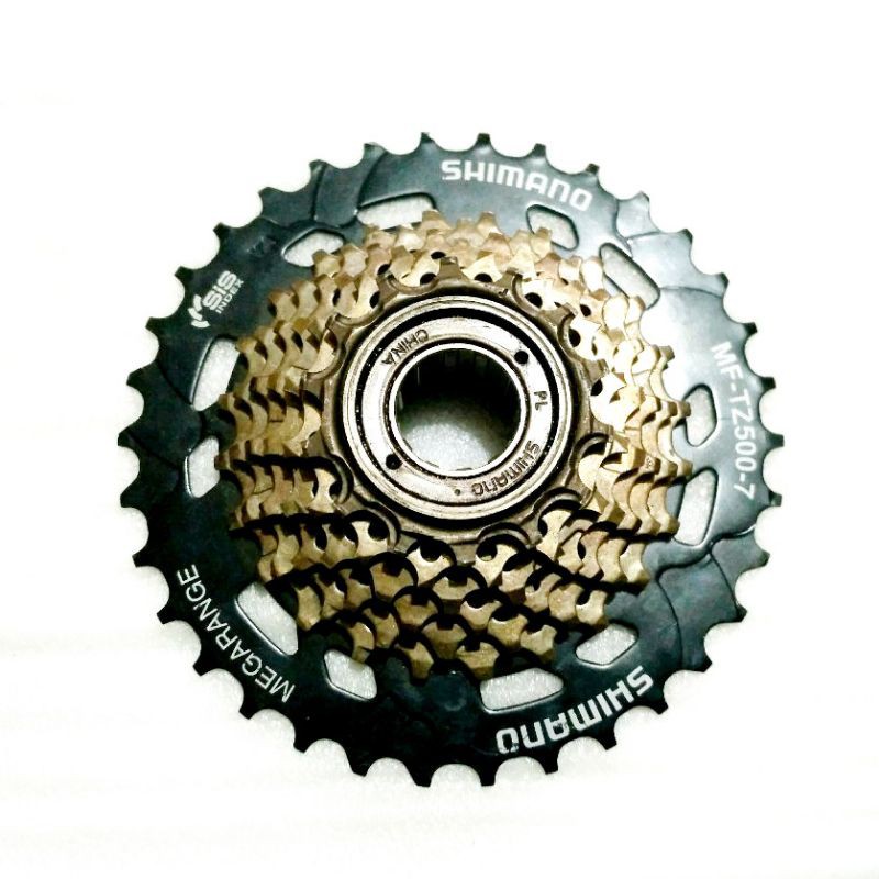 Jual Freewheel Drat Ulir 7 Speed Megarange. 14T - 34 T. Shimano MF ...