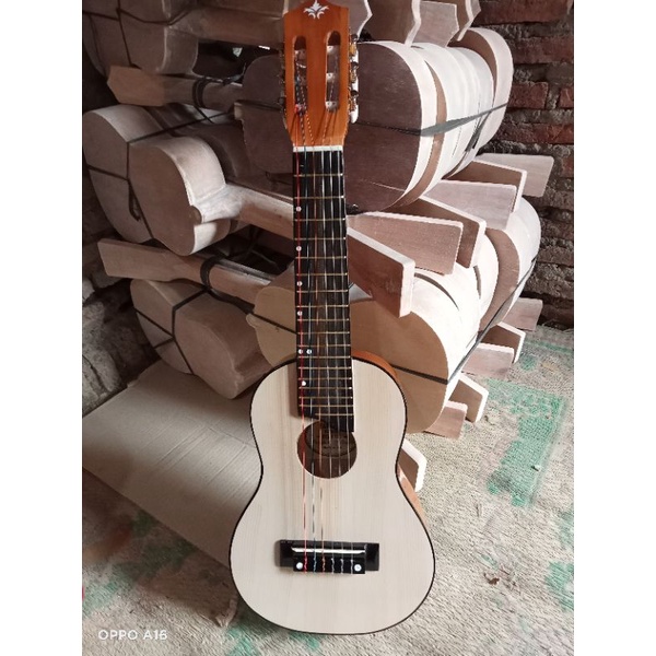 Jual gitar lele senar 6 nilon clasic warna natural crem. | Shopee Indonesia