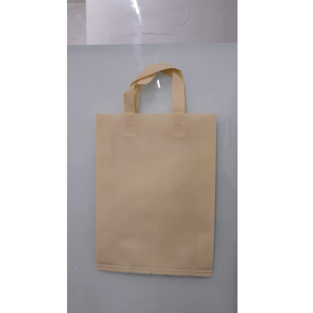 Jual Tas Press Spunbound Tali Goodie Bag Tas Belanja Warna Cream 25 cm ...