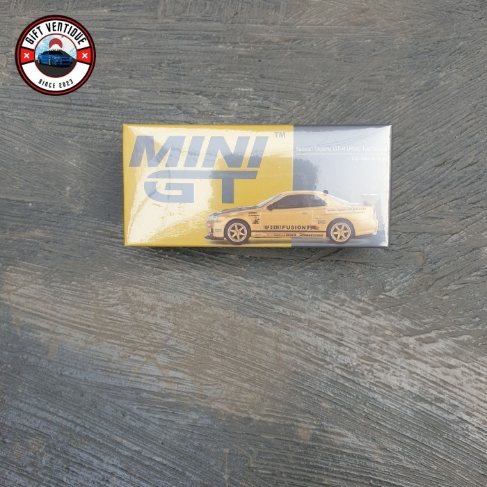 Jual Ready Mini GT MGT 676 Nissan Skyline GTR R34 Top Secret Gold Japan ...