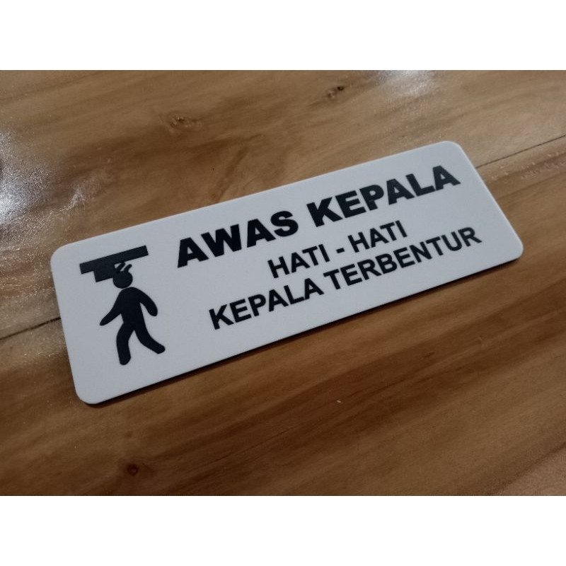 Jual signage label awas kepala | Label akrilik hati - hati terbentur ...