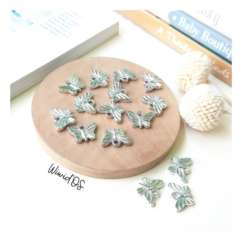 Jual (24 biji) MANIK PLASTIK CCB LIONTIN KUPU SILVER 14 mm | Shopee ...