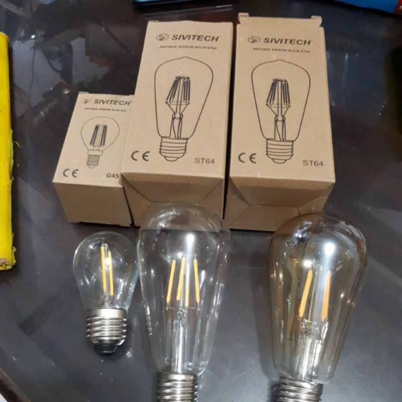 Jual LAMPU LED KUNING FITTING E27 CAFE G45 ST64 KACA BENING ST64 KACA ...
