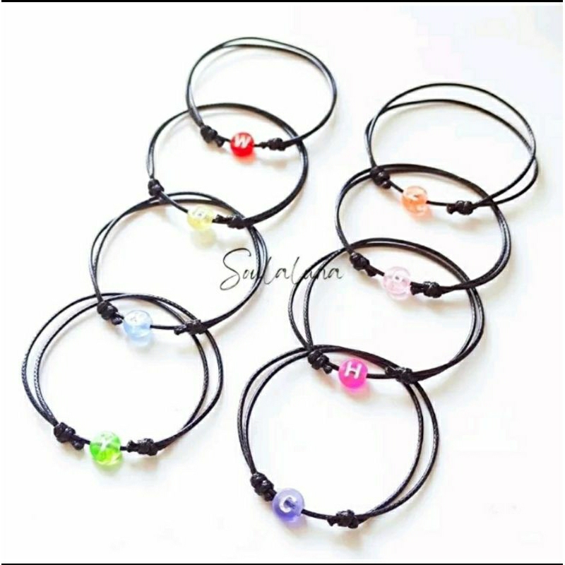 Jual gelang inisial nama couple bulat bening warna warni tulisan putih ...