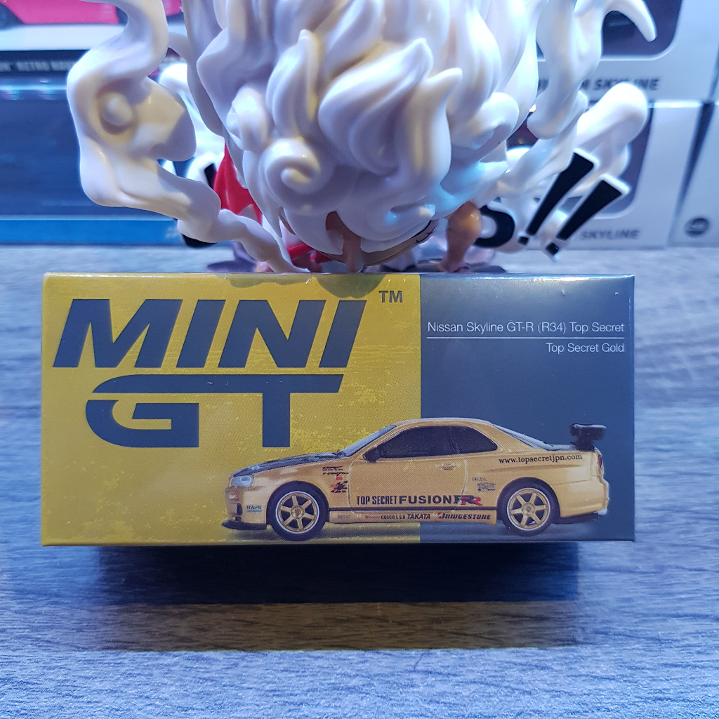 Jual MINI GT Nissan Skyline GT-R (R34) Top Secret Gold Japan Exclusive ...