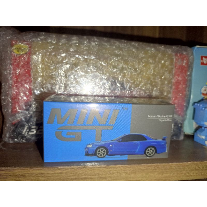 Jual MINI GT NISSAN SKYLINE GT-R R34 BAYSIDE BLUE #341 BIRU | Shopee ...