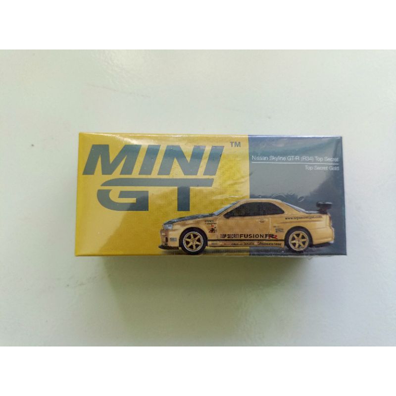 Jual Mini GT / MGT nissan skyline GTR (R34) top secret gold | Shopee ...