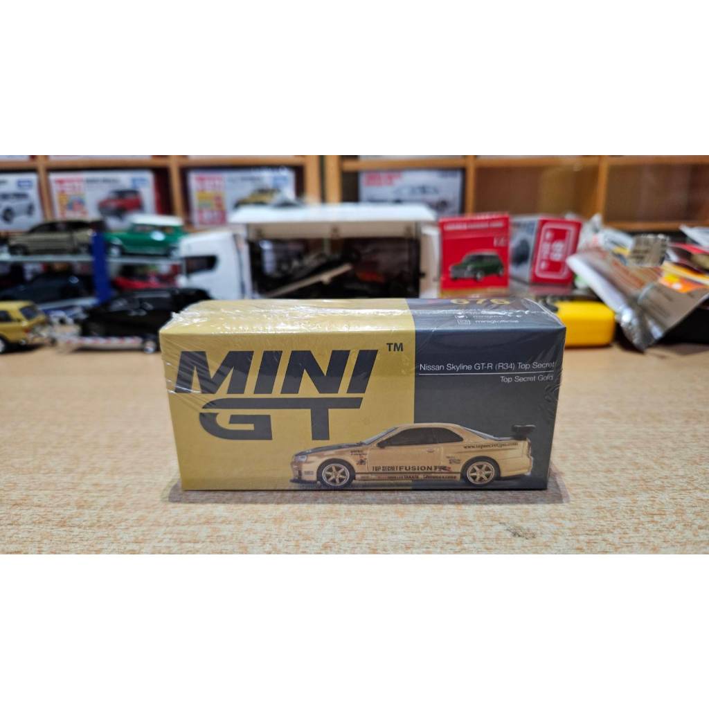 Jual Mini Gt 676 Nissan Skyline GT-R (R34) Top Secret Gold | Shopee ...