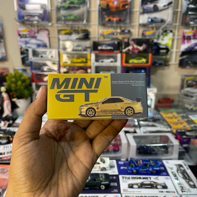 Jual Mini GT Nissan Skyline GT-R ( R34 ) Top Secret - Top Secret Gold ...