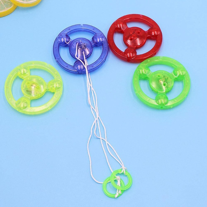 Jual mainan gangsing tarik lampu led warna / mainan gasing putar lampu ...