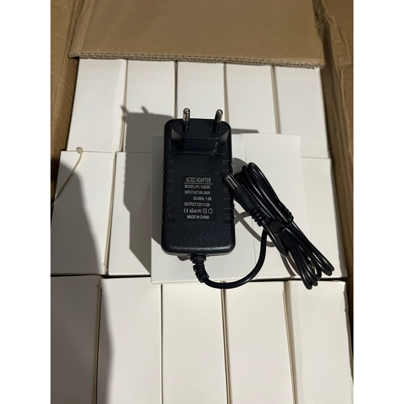 Jual Adaptor 12 Volt 2 Amper New gress lengkap dan dus | Shopee Indonesia