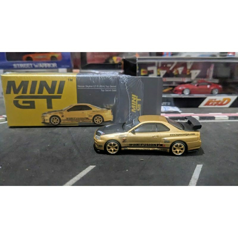 Jual Diecast Mini GT Nissan Skyline GTR R34 Top Secret Gold No 676 ...
