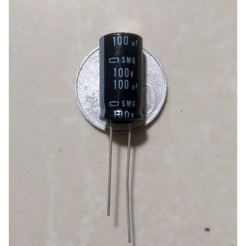Jual Kapasitor Elco 100/100 100uF100V 100uf/100V 100uF 100V Capacitor Nippon Chemicon SMG Japan ...