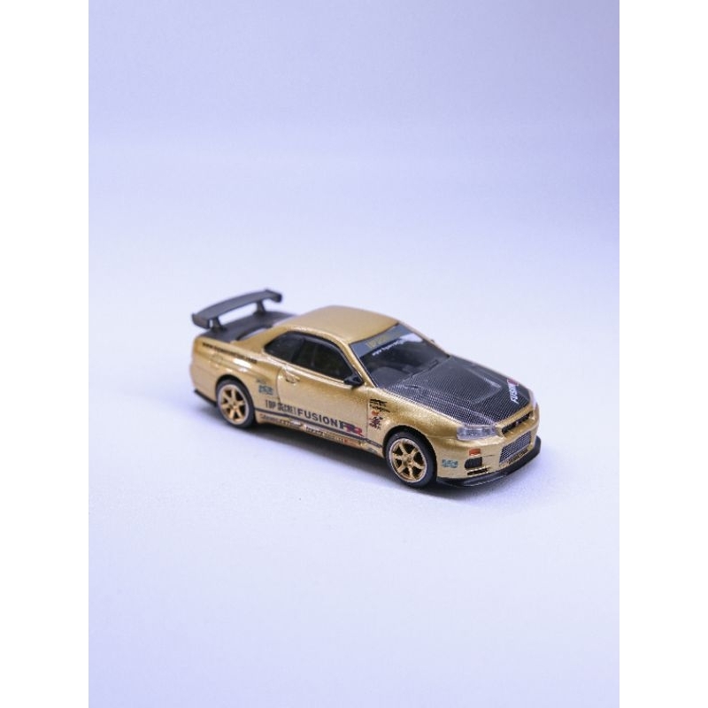Jual Nissan Skyline GT-R [R34]676 TOP SECRET. GOLD 1:64 | Shopee Indonesia