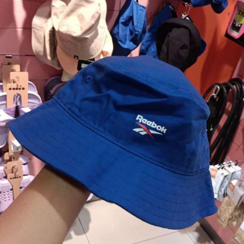 Jual bucket hat topi Reebok cl flo mars red, patriot blue, dan black ...
