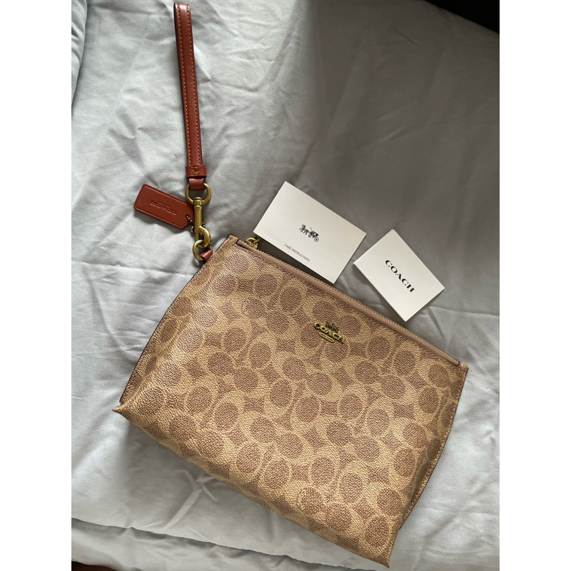 Jual Coach pouch in signature canvas | Shopee Indonesia