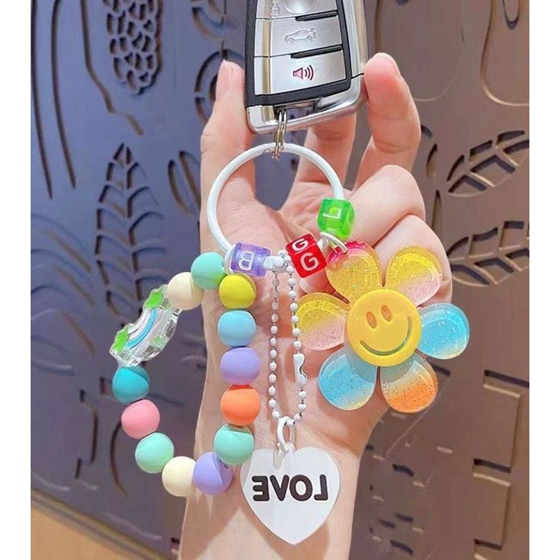 Jual BRG - bunga rantai gradasi gantungan kunci bag charm matahari ...