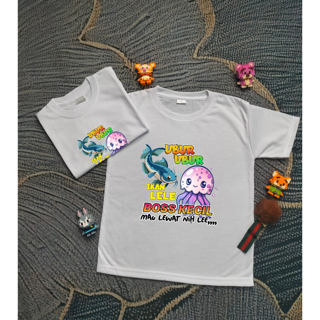 Jual Baju Kaos anak anak UBUR - UBUR IKAN LELE BOS KECIL MAU LEWAT NIH LE !! yang bisa di pakai ...