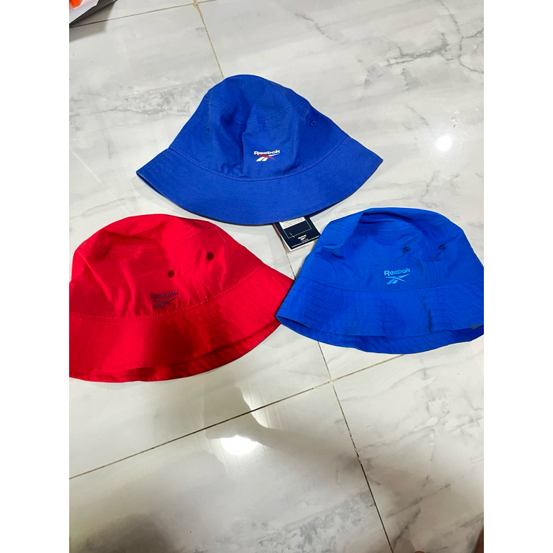 Jual Topi bucket hat parasut/ katun Reebok biru dan merah sale 80% ...