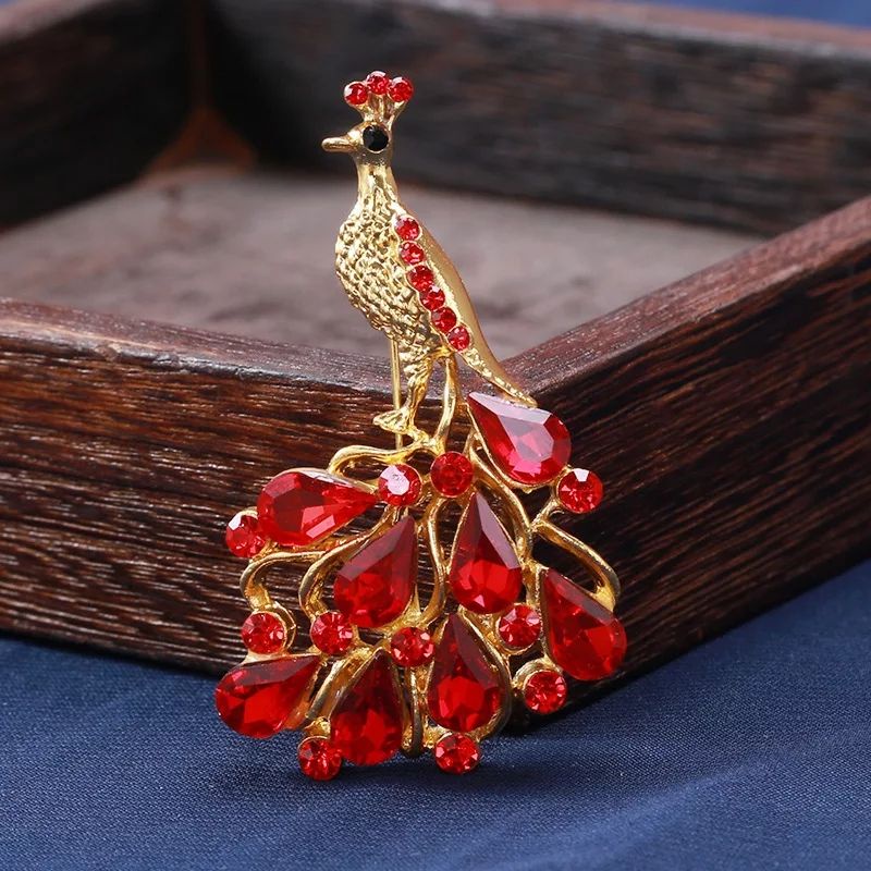 Jual bros elegan kristal merah bentuk burung merak untuk hadian ...