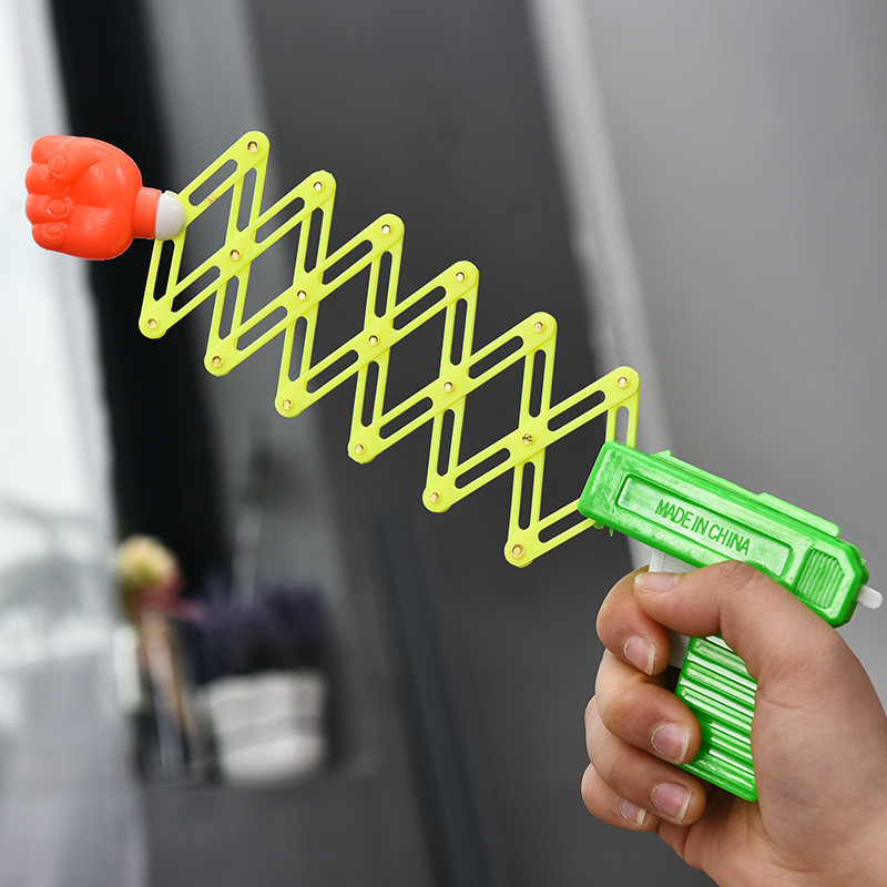 Jual Retractable Fist Shooter Trick Toy Gun Funny Child Kids plastic ...