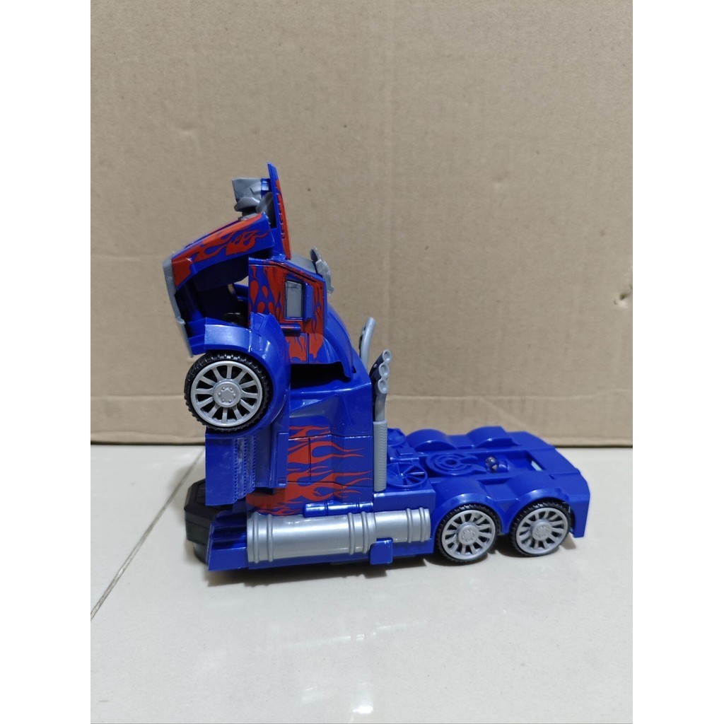 Jual PROMO mainan mobil robot optimus prime 2in1deformation super car ...